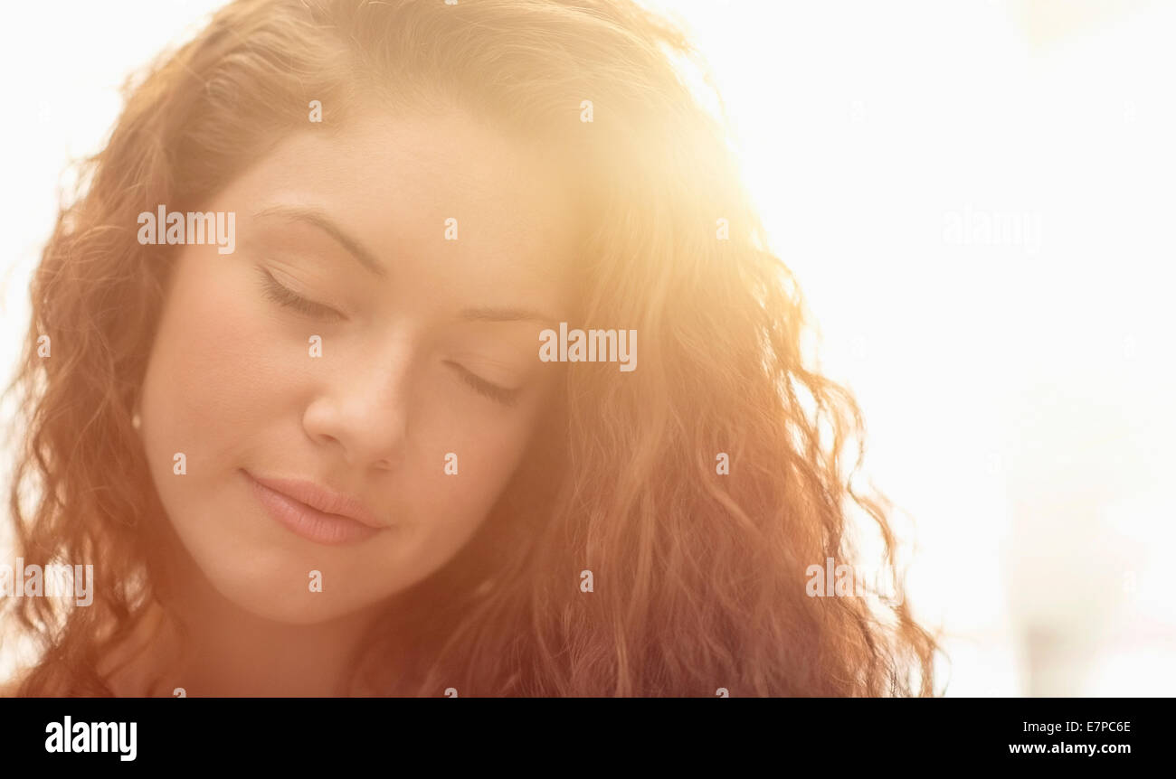 Portrait of woman in sunlight Stock Photo - Alamy