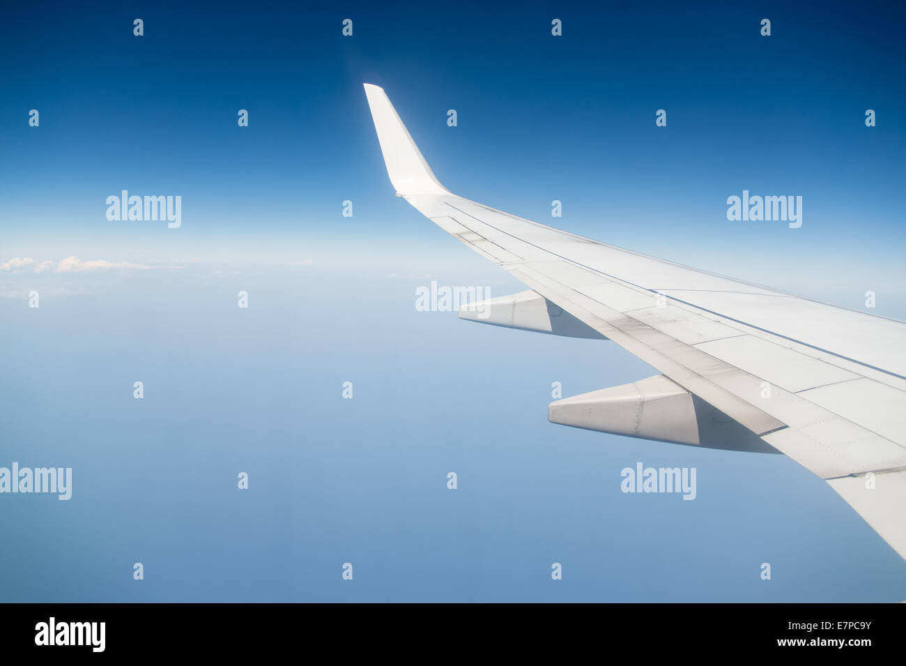 Airplane is flying through the sky without any clouds but with the left ...