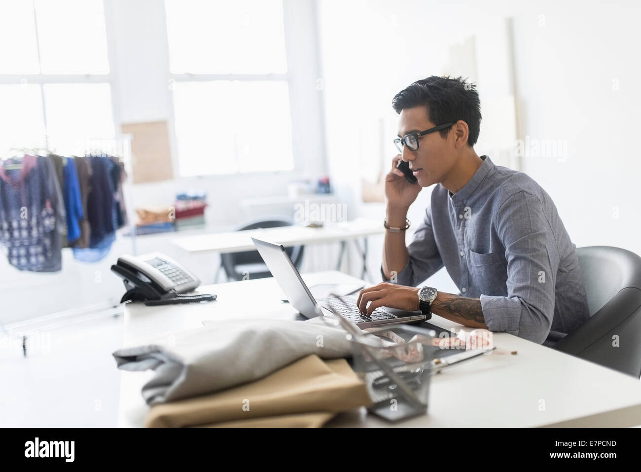 Side view of man working in studio Stock Photo - Alamy