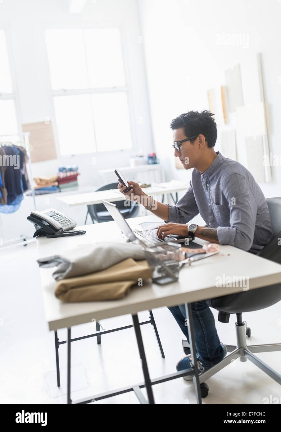 Side view of man working in studio Stock Photo - Alamy