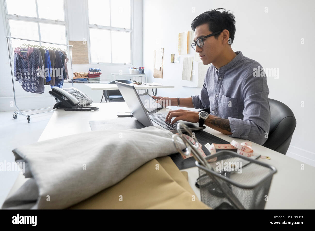 Fashion designer working in studio Stock Photo - Alamy