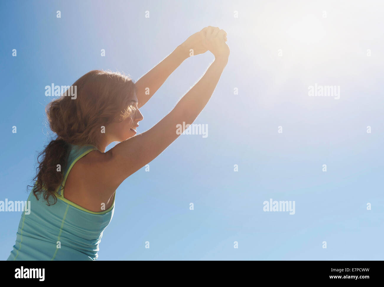 Woman arms raised rear view sky hi-res stock photography and images - Alamy