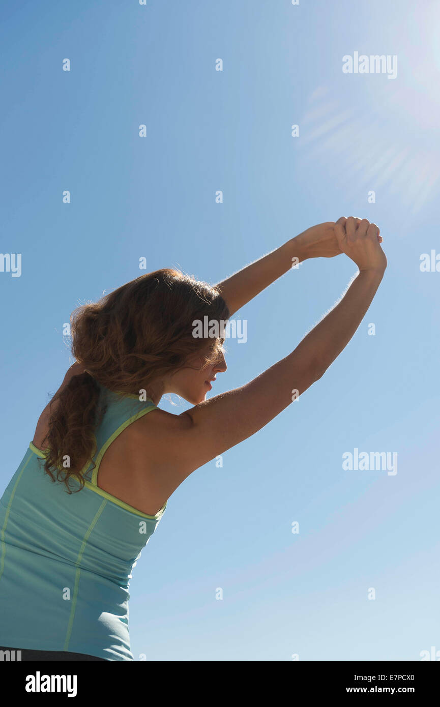 Woman arms raised rear view hi-res stock photography and images - Alamy