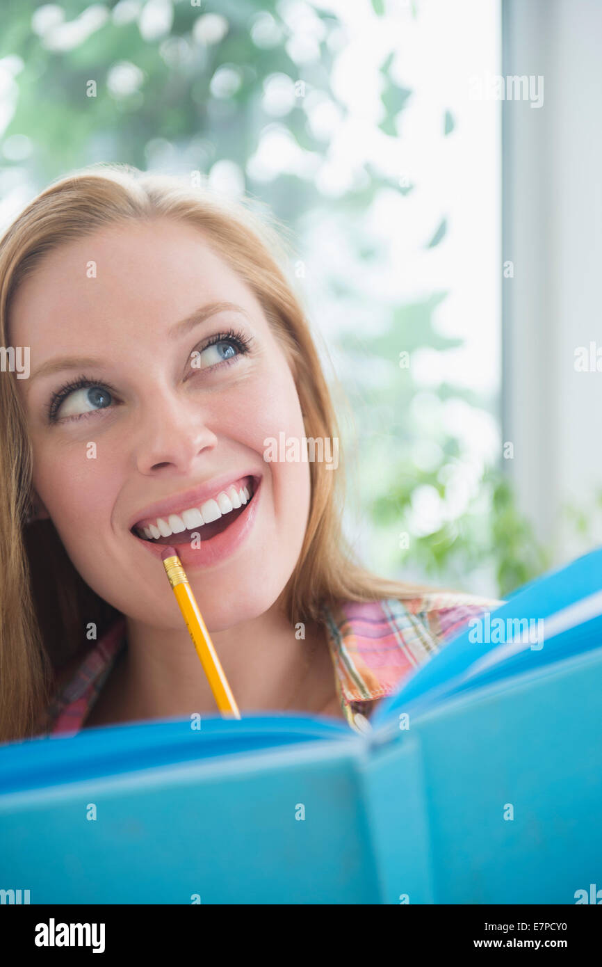 Portrait of young woman planning Stock Photo - Alamy