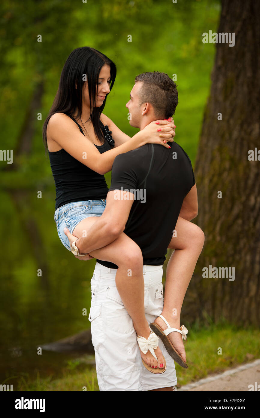 Teenage couple on a late summer afternoon in park Stock Photo - Alamy