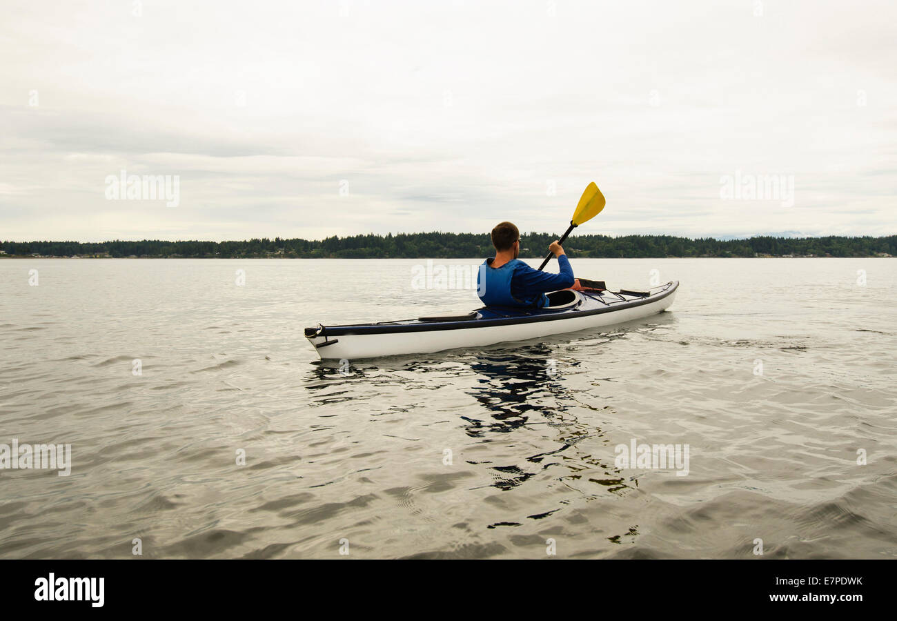 USA, Washington State, Olympia, Man kayaking on lake Stock Photo - Alamy