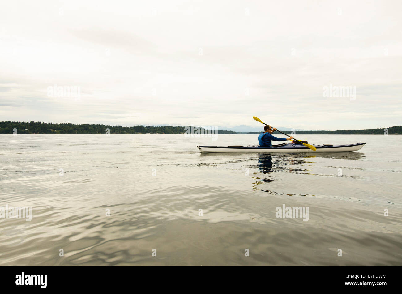 USA, Washington State, Olympia, Man kayaking on lake Stock Photo - Alamy