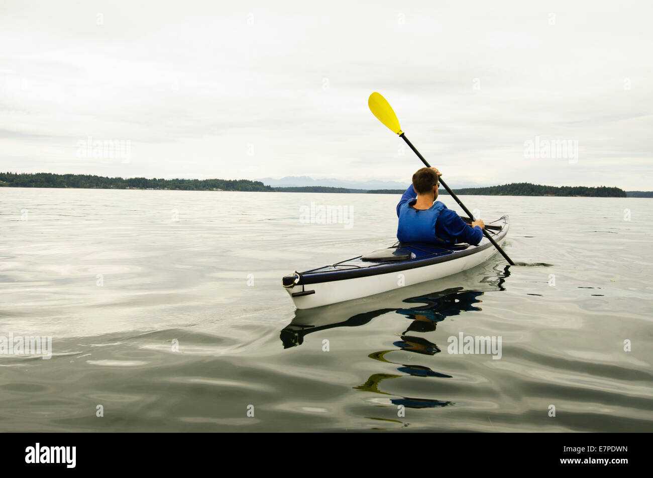 Man kayaking on lake Stock Photo - Alamy
