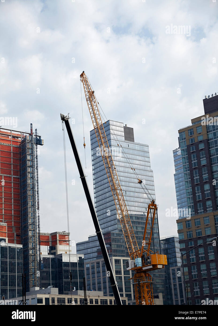 USA, New York State, New York City, Cranes in urban scene Stock Photo ...