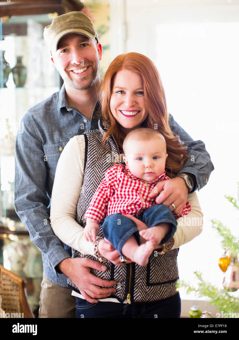 Studio shot portrait of family with one child (2-5 months Stock Photo ...