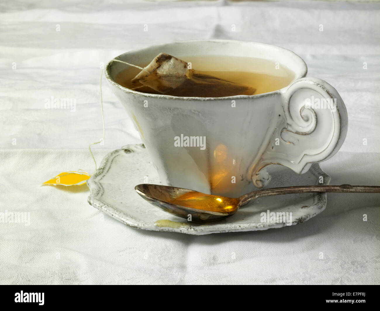 Antique teacup on table Stock Photo - Alamy