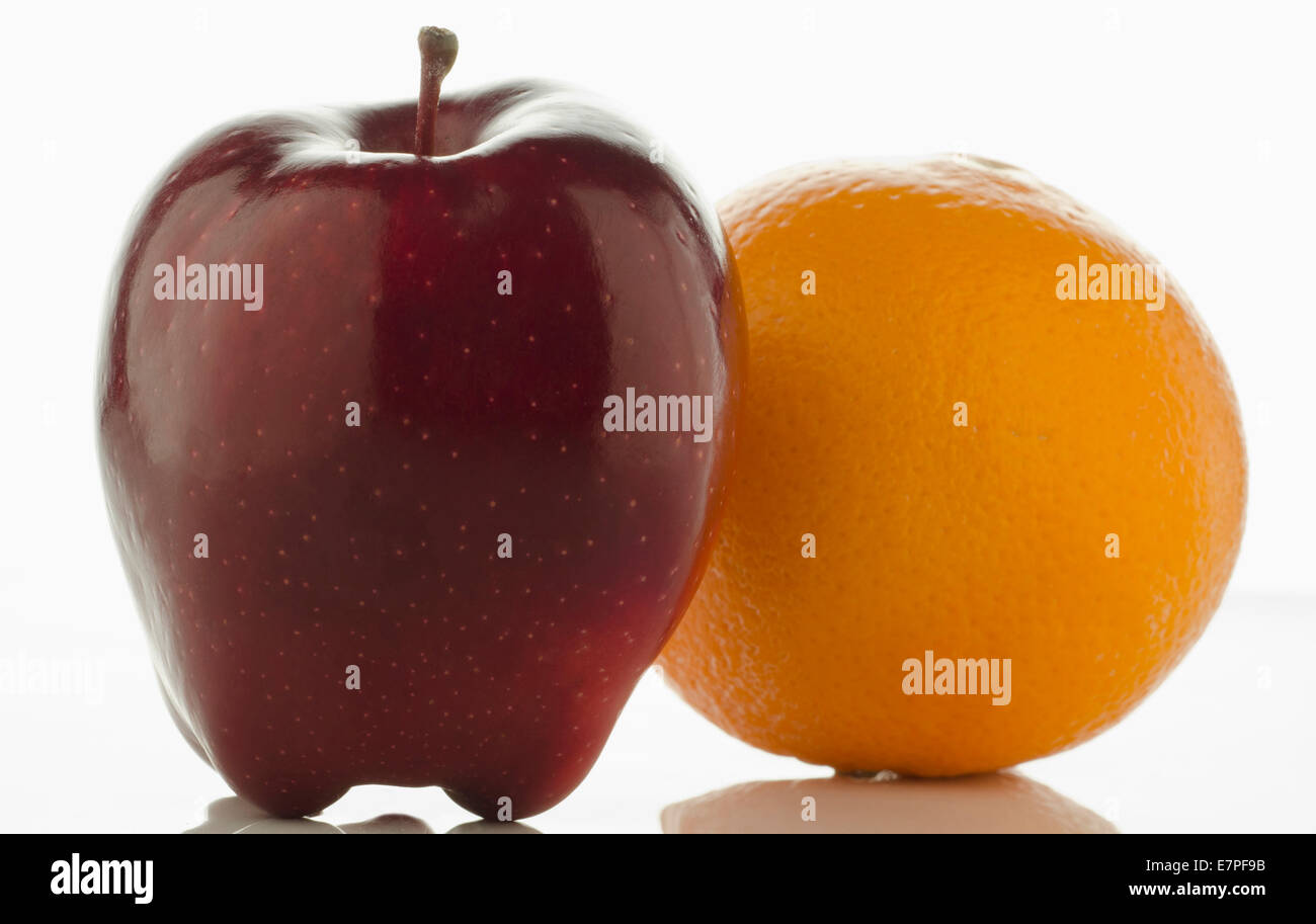 Studio shot of apple and orange Stock Photo - Alamy