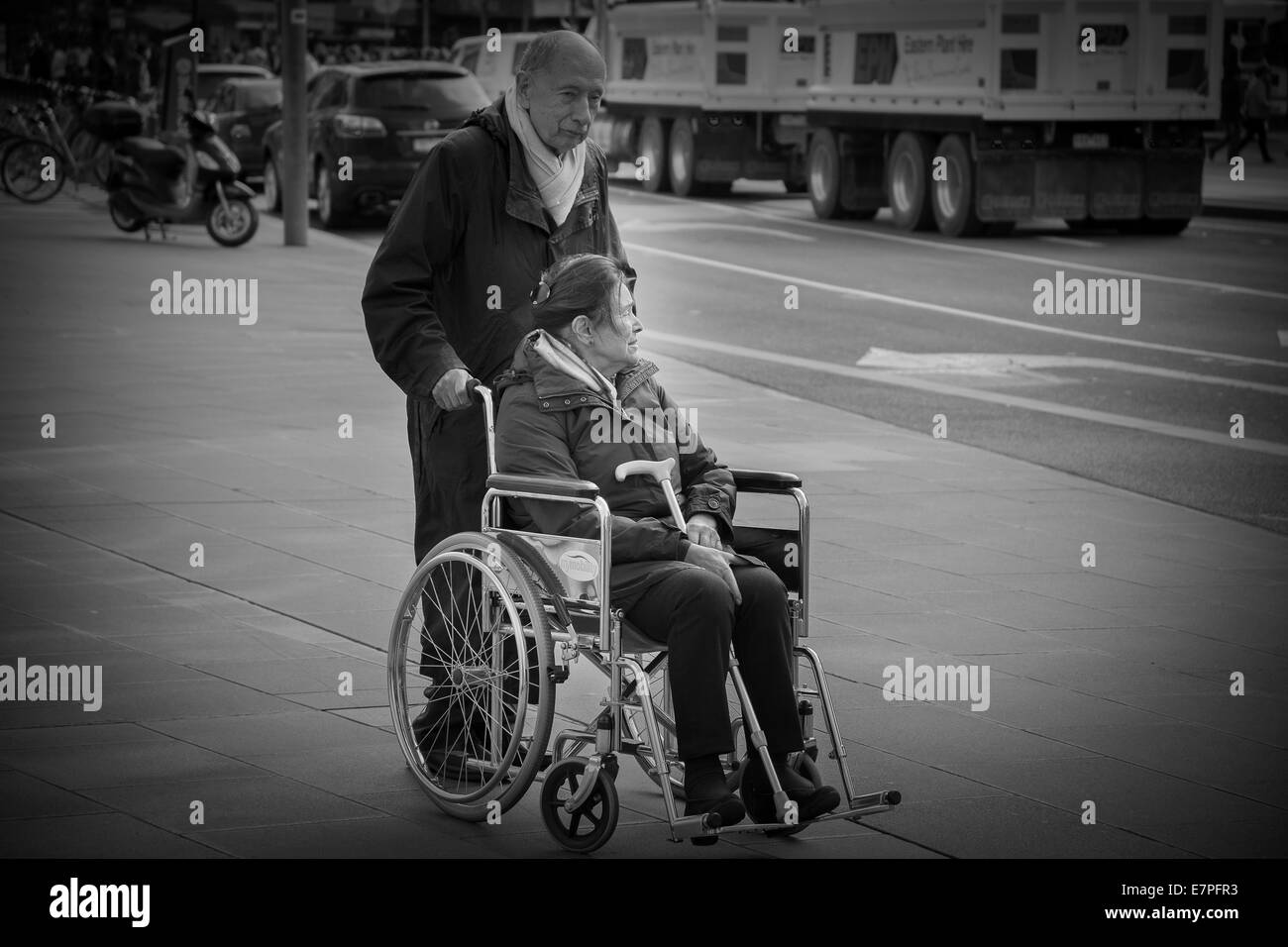 Old man pushing wheelchair hi-res stock photography and images - Alamy
