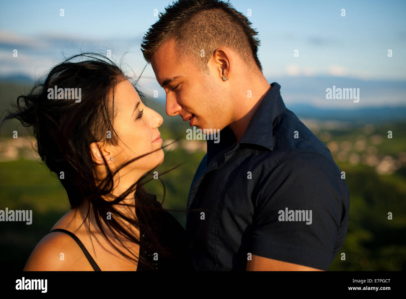 Teenage couple on a late summer afternoon in park Stock Photo - Alamy