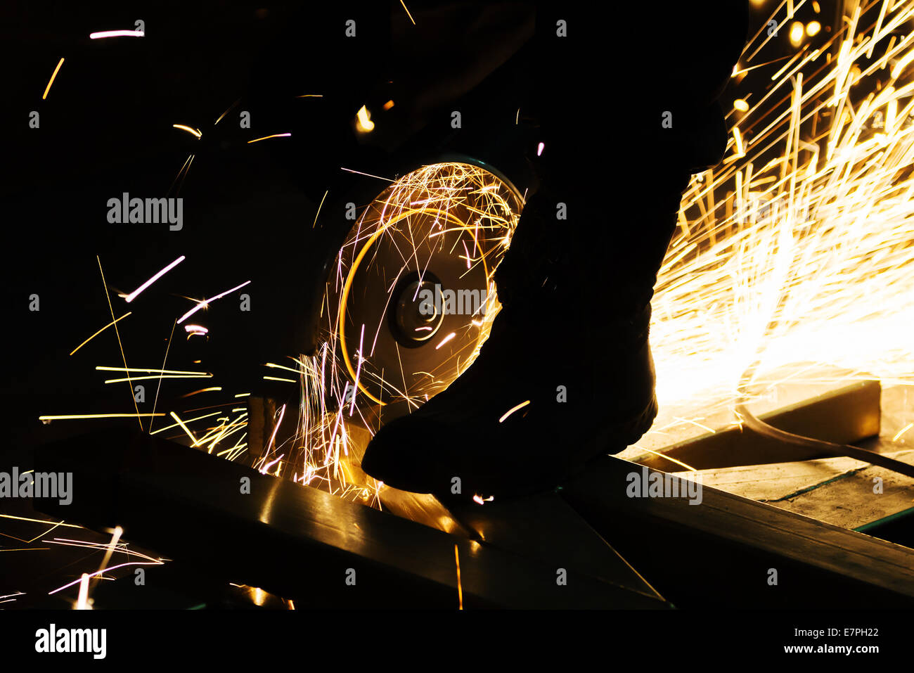 sharpening and cutting of iron by abrasive disk machine Stock Photo - Alamy