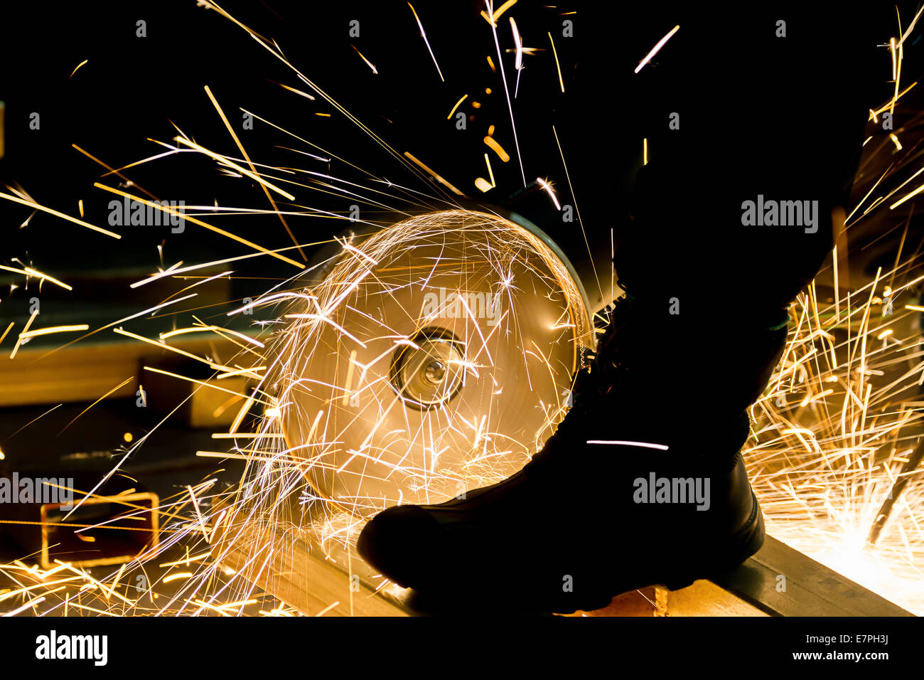 sharpening and cutting of iron by abrasive disk machine Stock Photo - Alamy