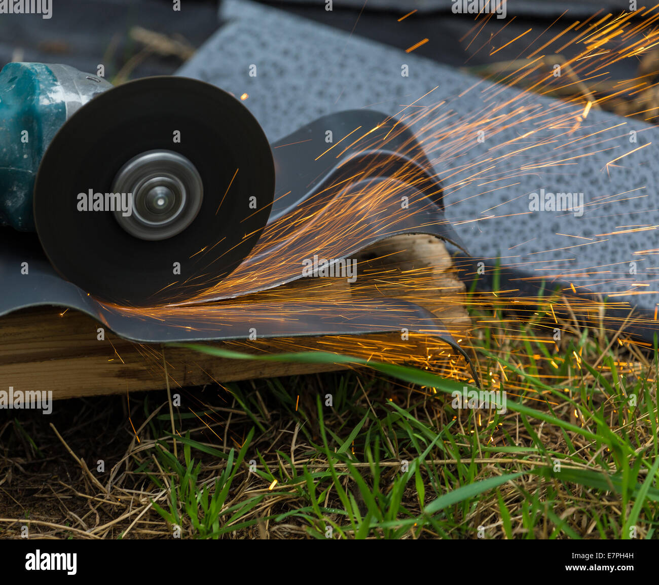 sharpening and cutting of iron by abrasive disk machine Stock Photo - Alamy