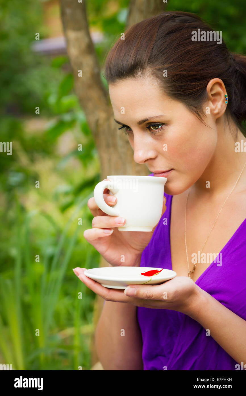 Woman drinking hot chocolate outdoors hi-res stock photography and ...