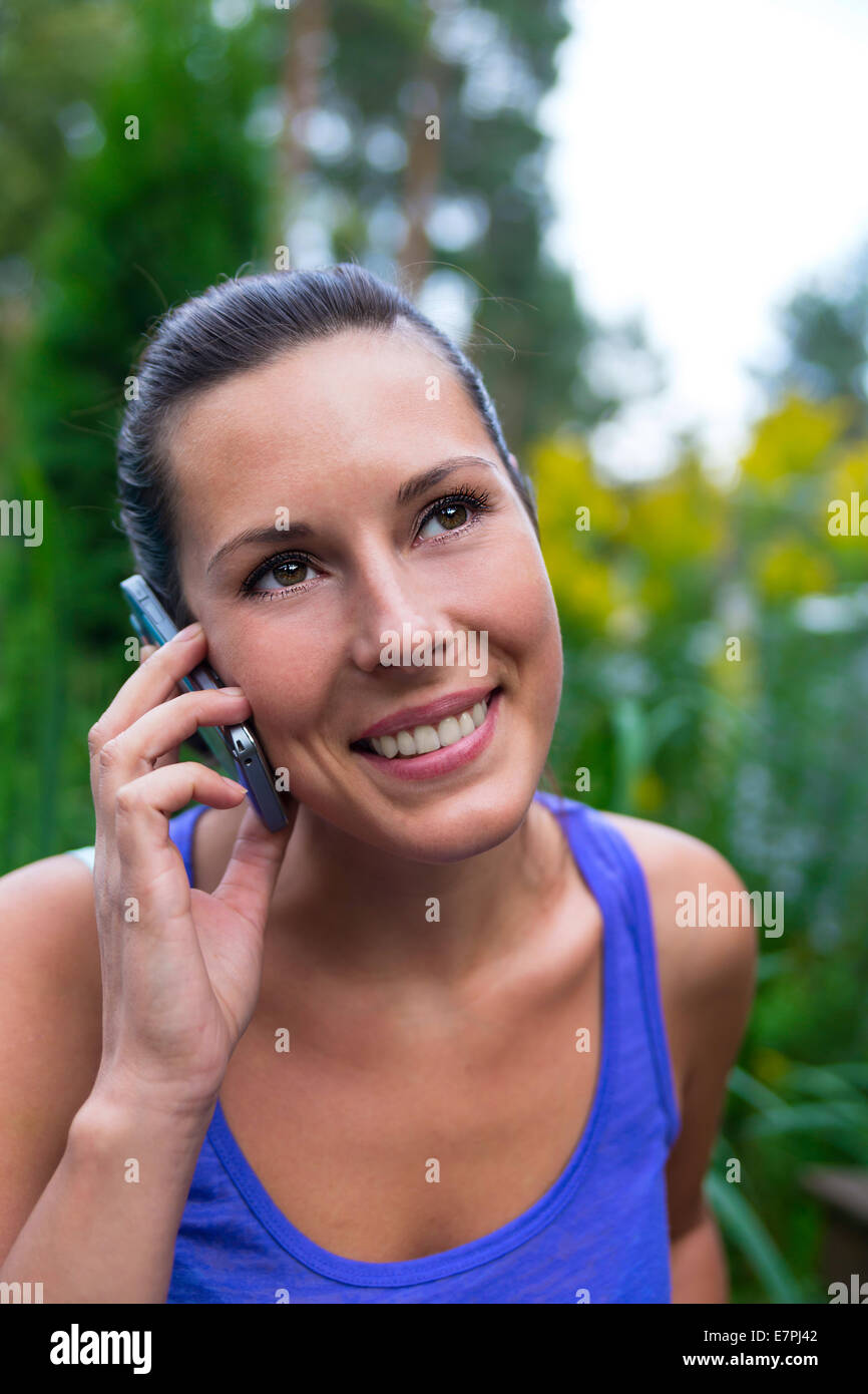 Young pretty woman and mobile phone Stock Photo - Alamy