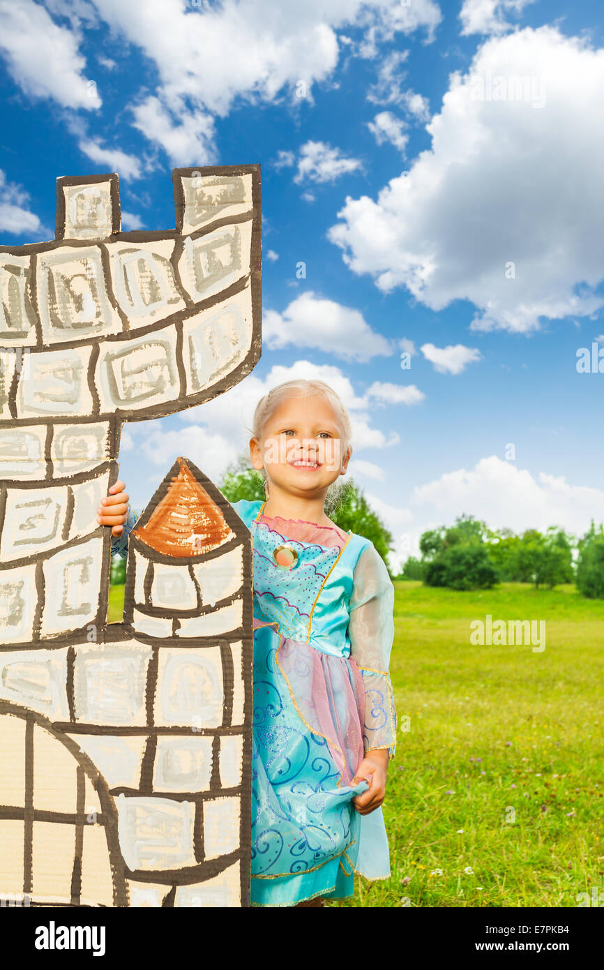 Small cute princess stands behind the drawn tower Stock Photo - Alamy