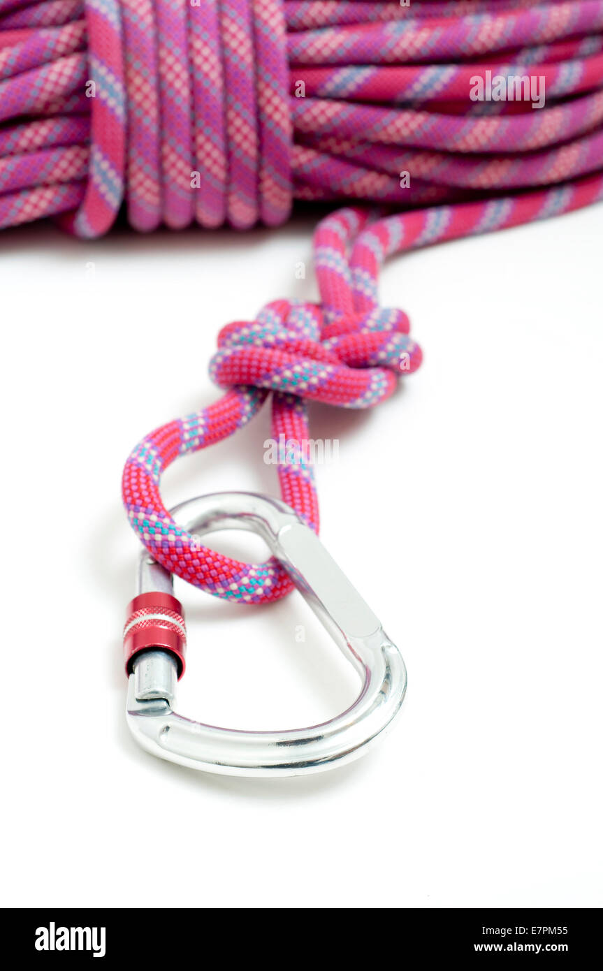 Carabiner attached to mountaineers rope, ready for climbing Stock Photo ...