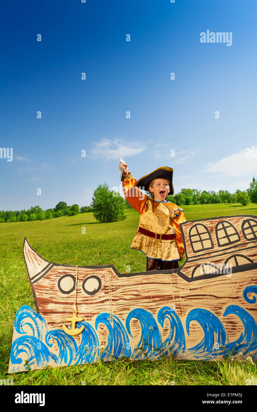 Excited boy in pirate costume laughing on ship Stock Photo - Alamy