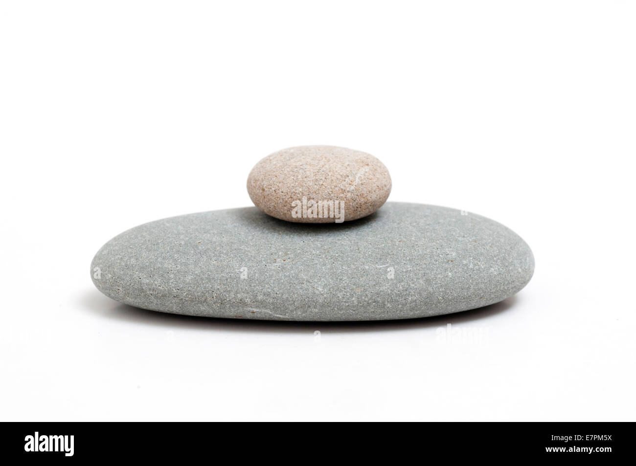 Two pebbles together with different shapes and sizes Stock Photo - Alamy