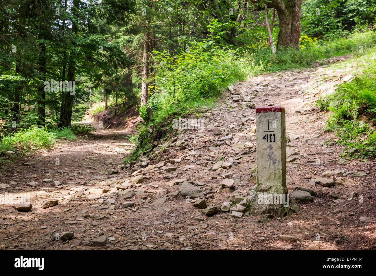 Border post on mountain trail Stock Photo - Alamy