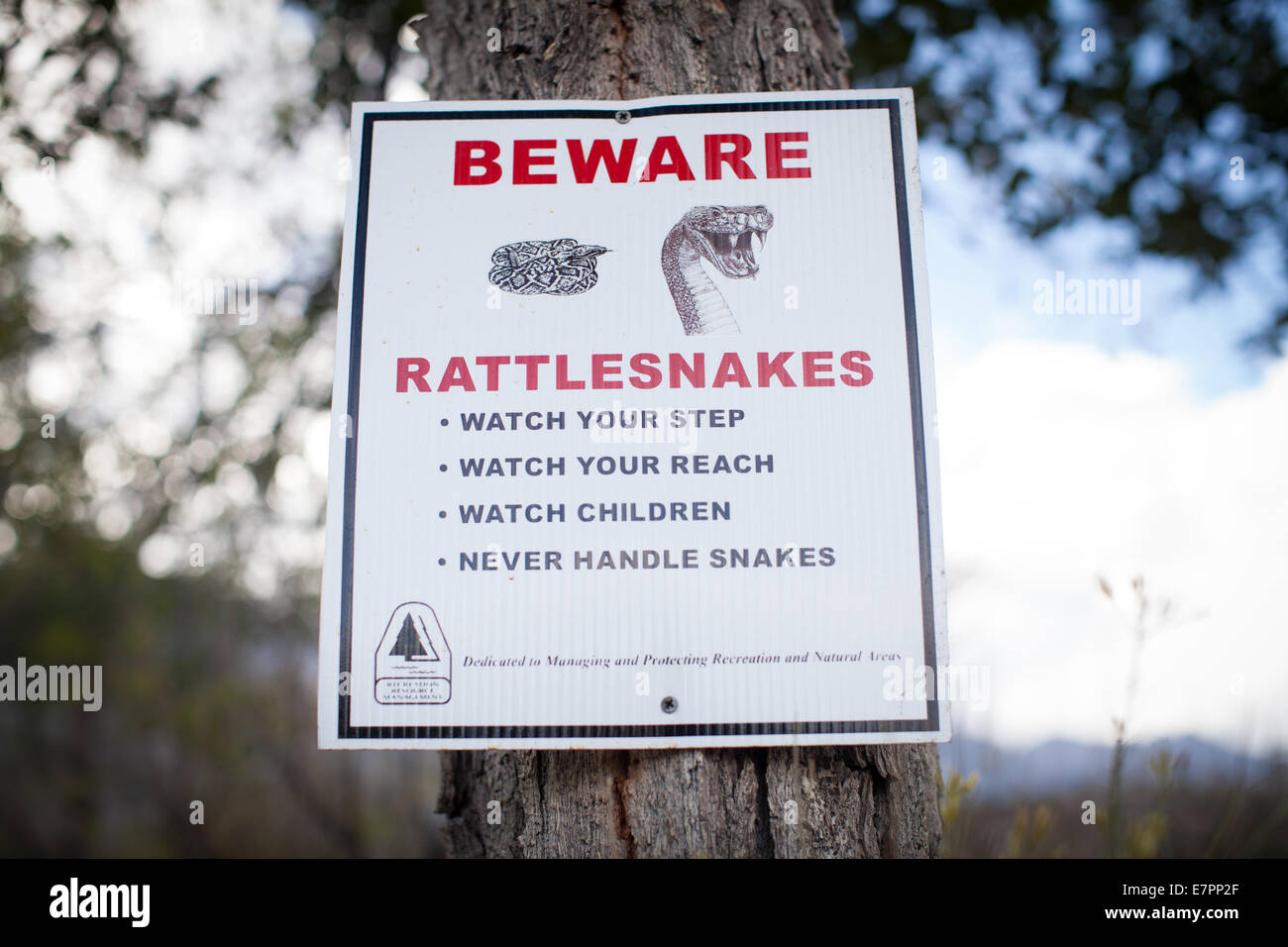 Beware of Rattlesnakes sign Stock Photo - Alamy