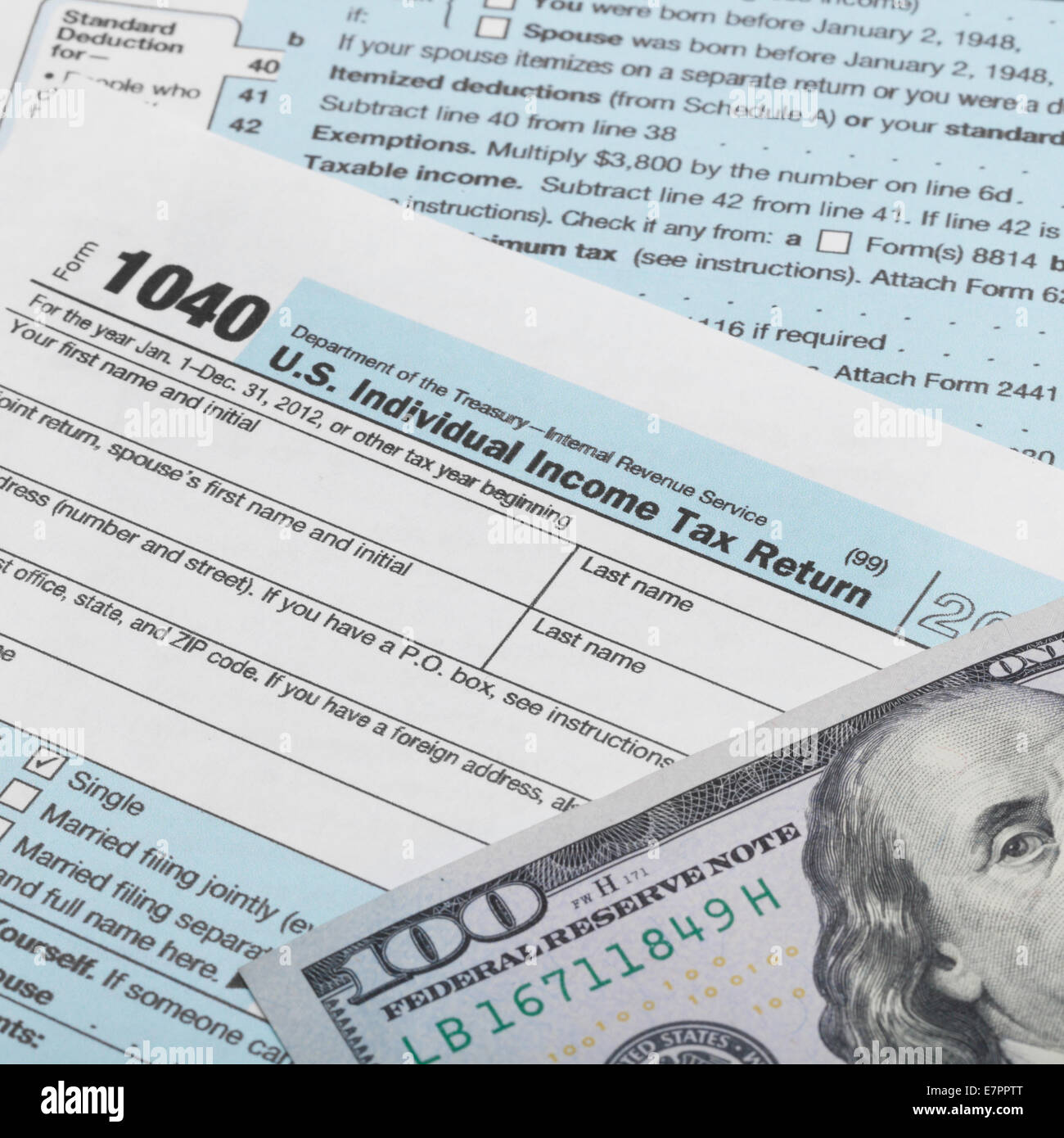 US Tax Form 1040 with 100 dollars banknote above it - 1 to 1 ratio ...