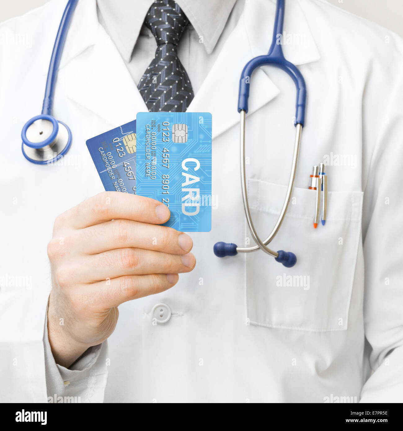 Doctor holding money credit card hi-res stock photography and images ...