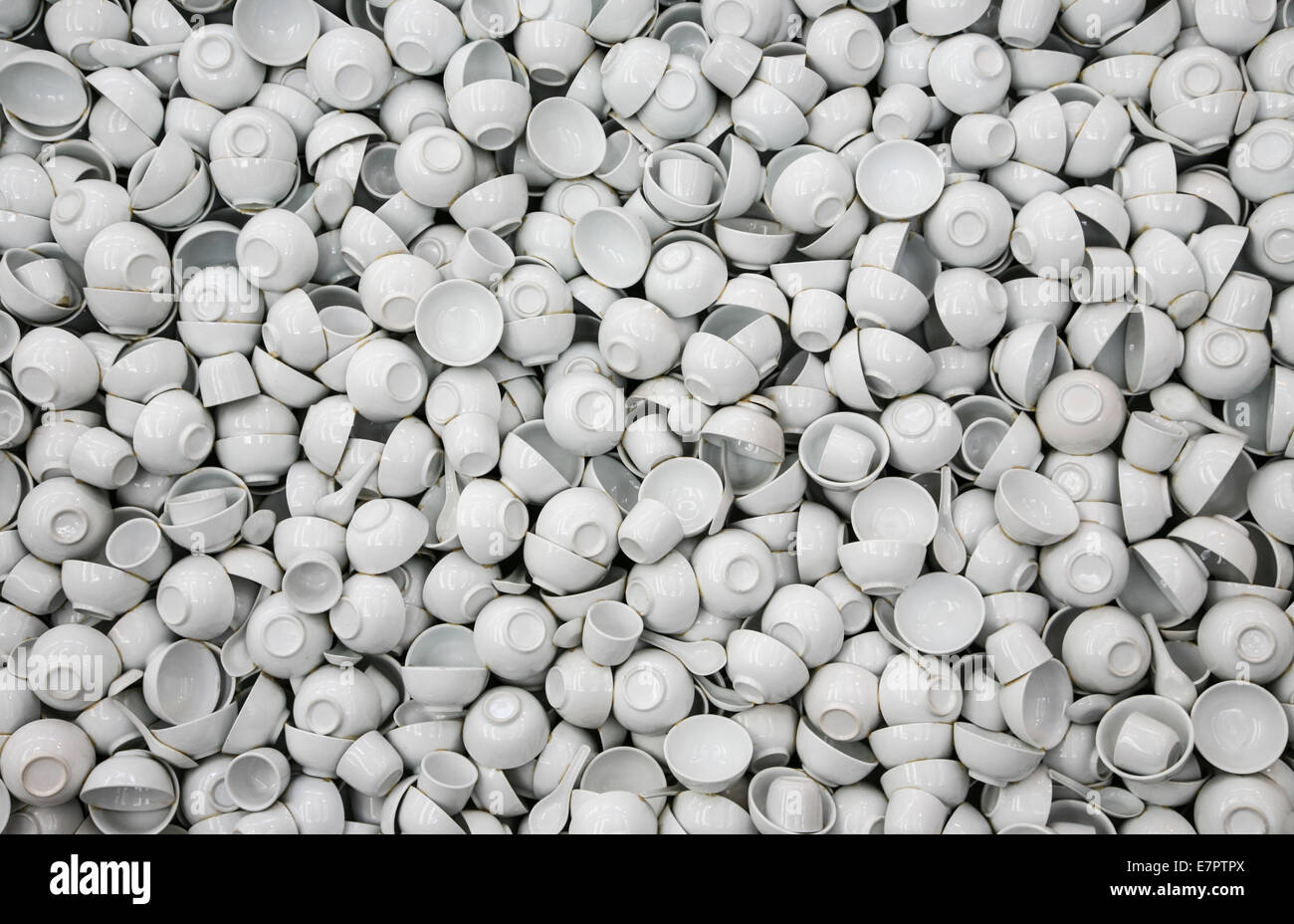 Group of white dishes and cups merging together for a display ...