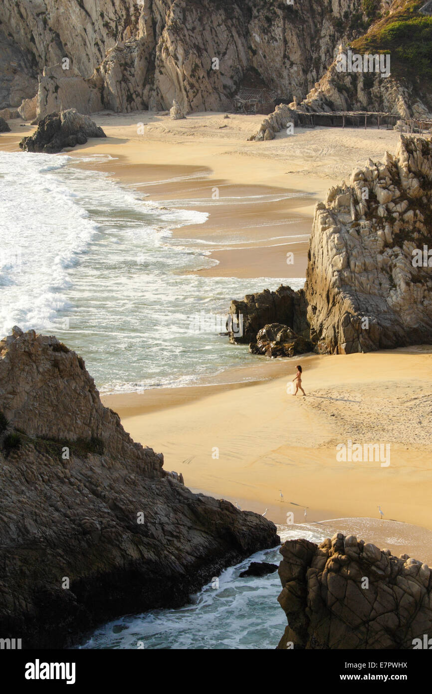 Woman walks on the beach at Maruata, Michoacan, Mexico Stock Photo - Alamy