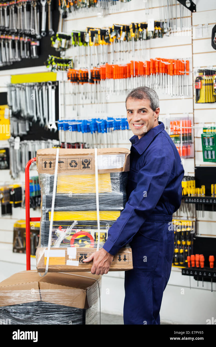 Worker Keeping Tool Package On Trolley Stock Photo - Alamy