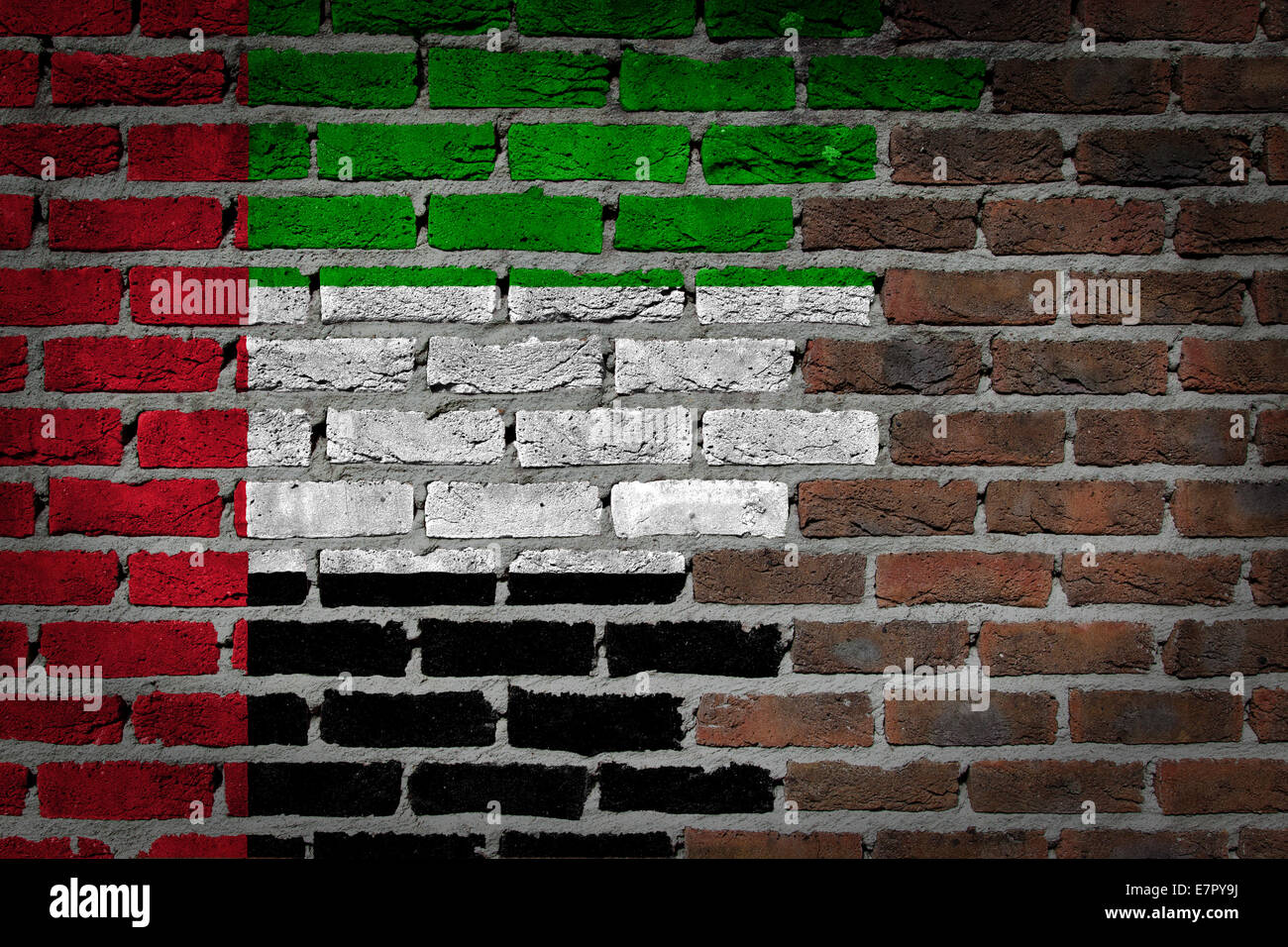 Dark brick wall texture - flag painted on wall - UAE Stock Photo - Alamy