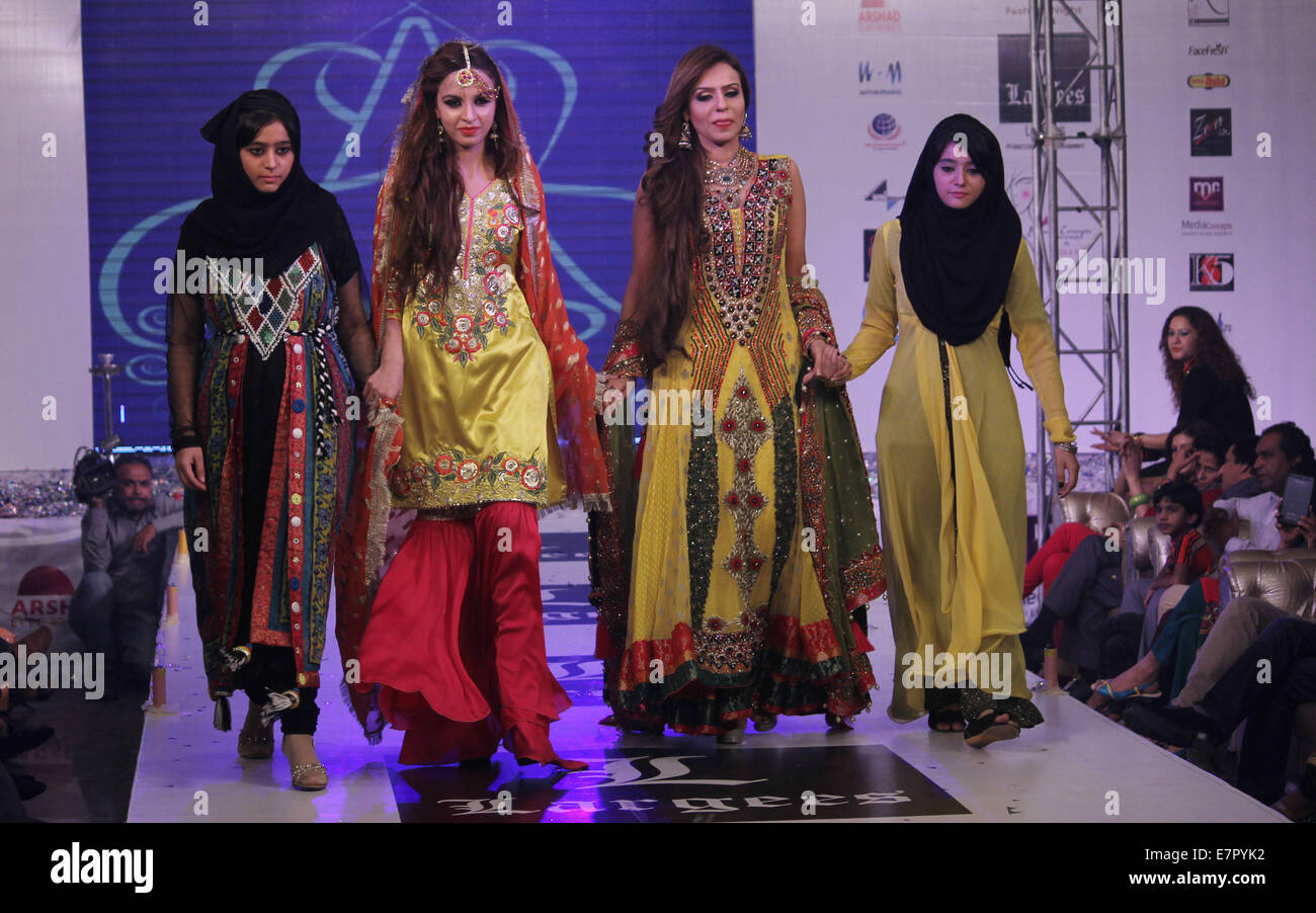 Lahore, Pakistan. 21st Sep, 2014. Pakistani models walk on the ramp to ...