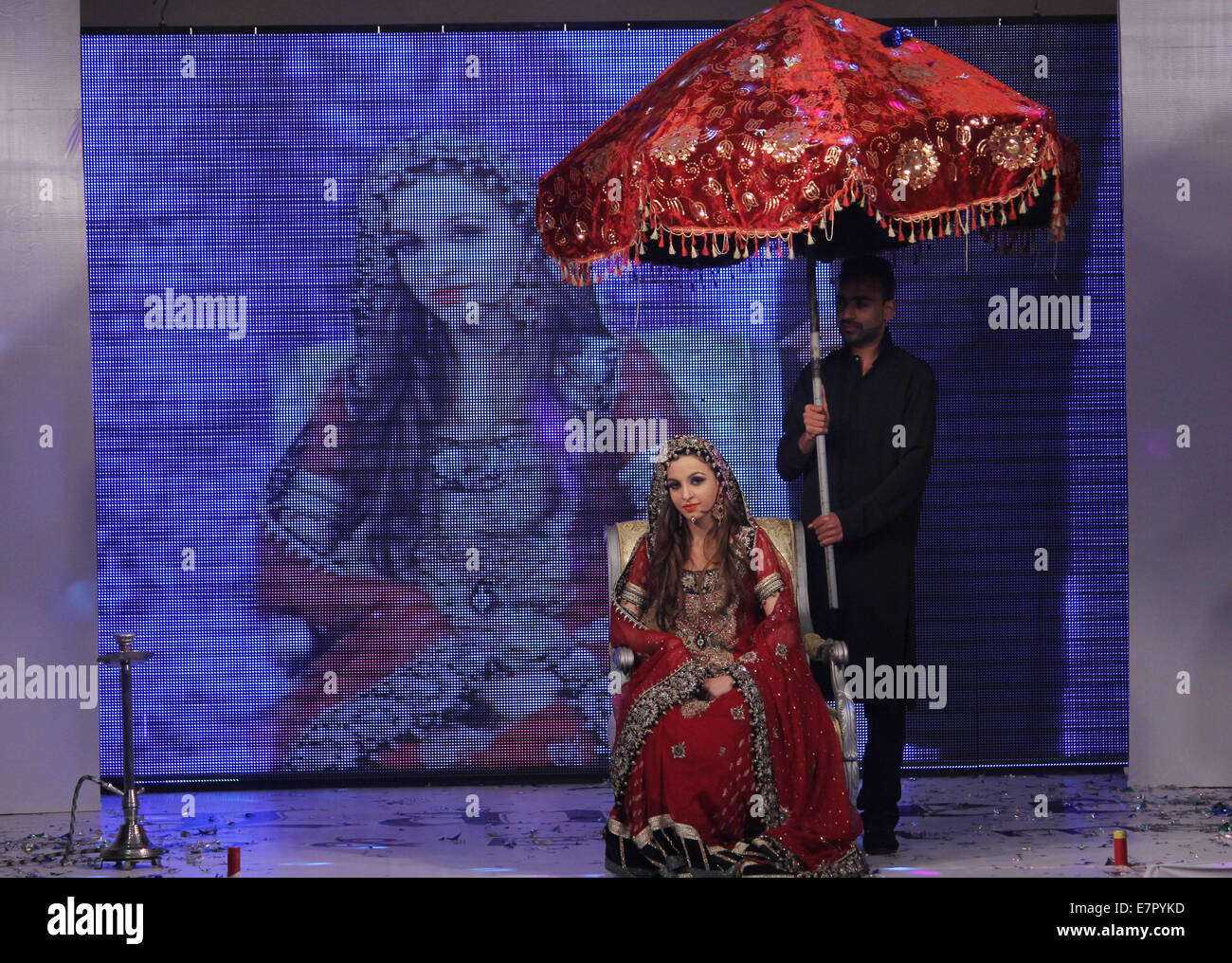 Lahore, Pakistan. 21st Sep, 2014. Pakistani models walk on the ramp to ...