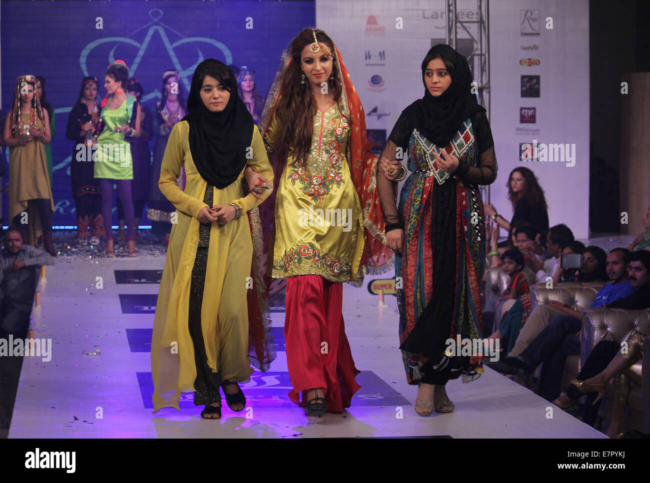 Lahore, Pakistan. 21st Sep, 2014. Pakistani models walk on the ramp to ...