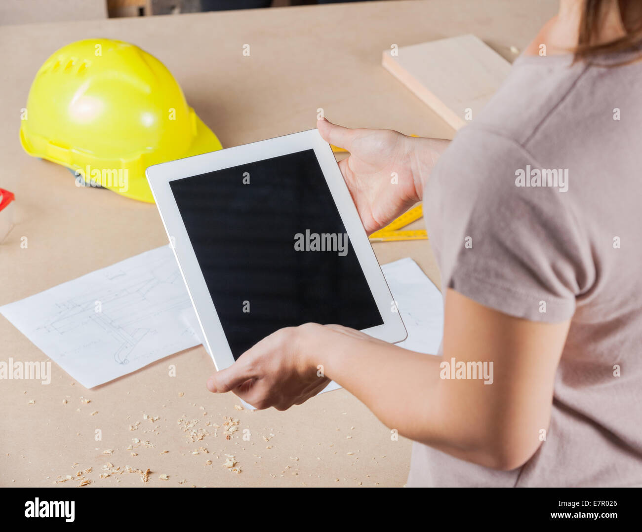 Architect Holding Digital Tablet In Workshop Stock Photo - Alamy