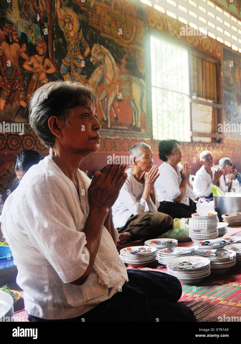 Phnom Penh, Cambodia. 22nd Sep, 2014. Buddhists pray at a temple during ...