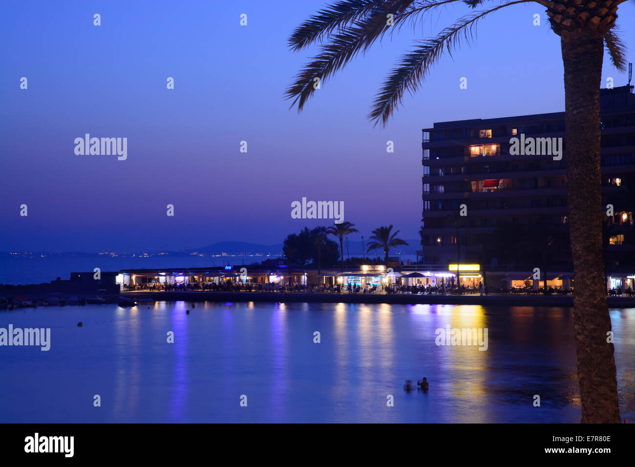 Blue hour on the jetty, with open bars and restaurants. Cala Estancia ...