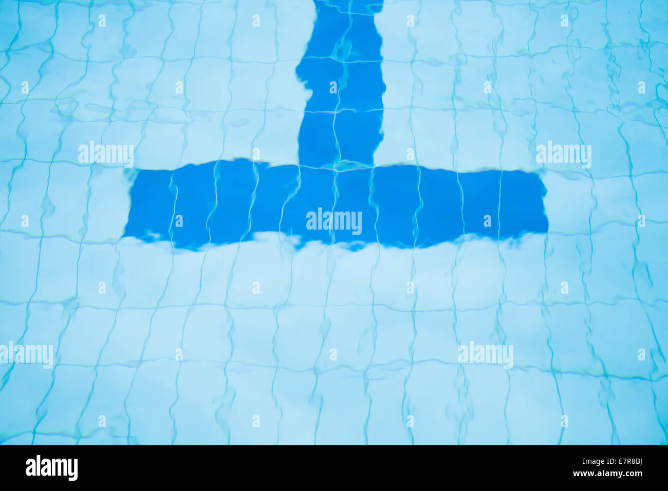 Closeup of bottom lane line at end of swimming pool with T-shape ...