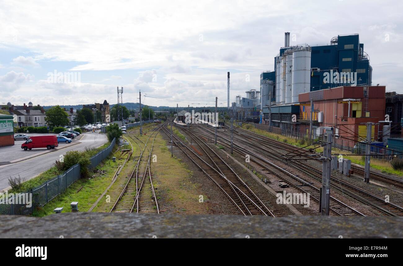 Railway lines by the side on industrial buildings Stock Photo - Alamy