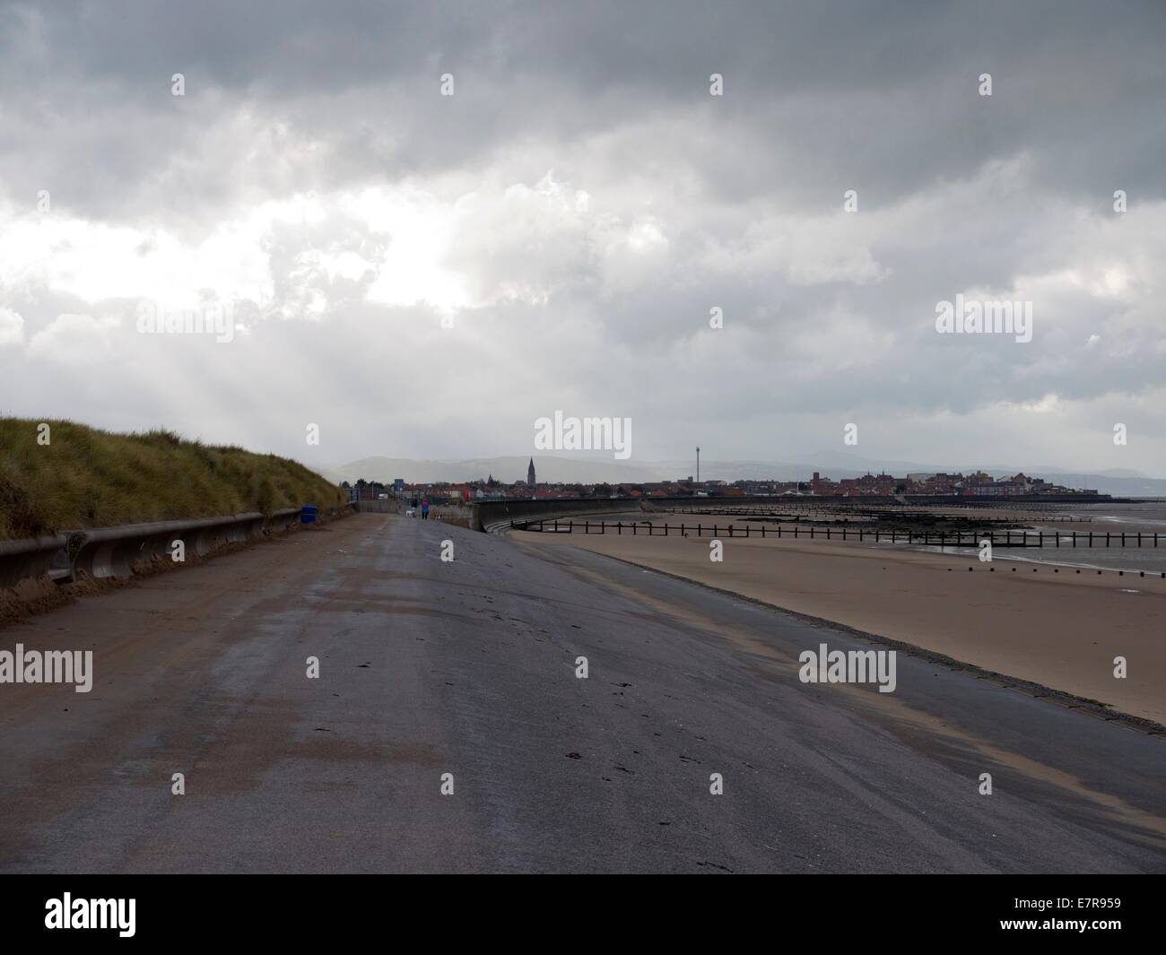 Coastal path leading into the distance with the beach and sea along ...