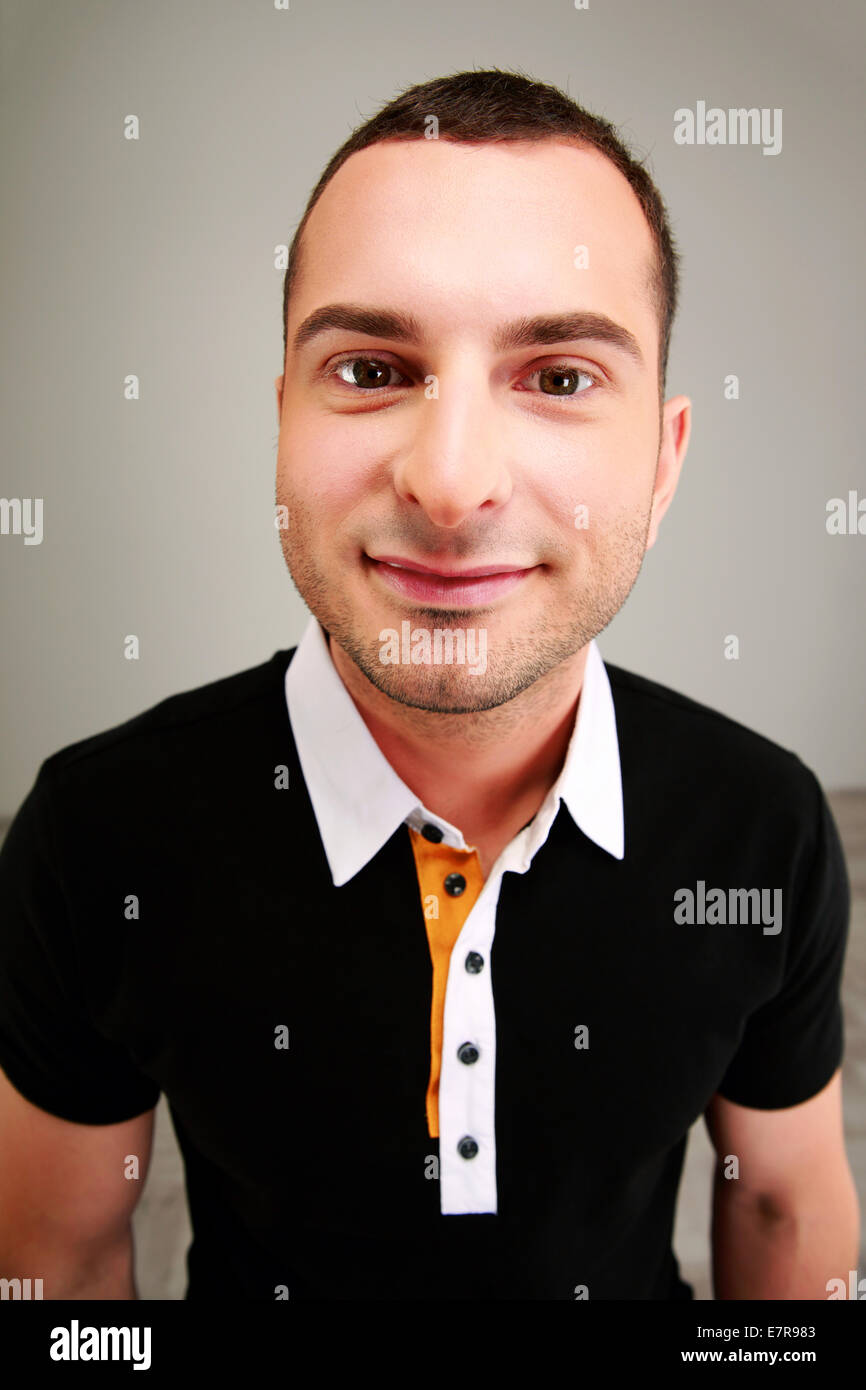 Portrait of a happy man having fun over gray background Stock Photo - Alamy