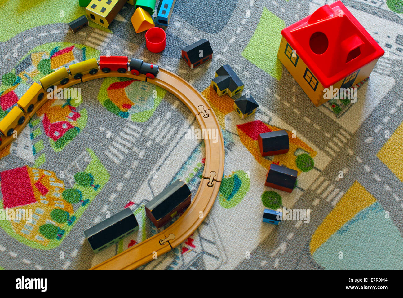 wooden toy train and some house Stock Photo - Alamy