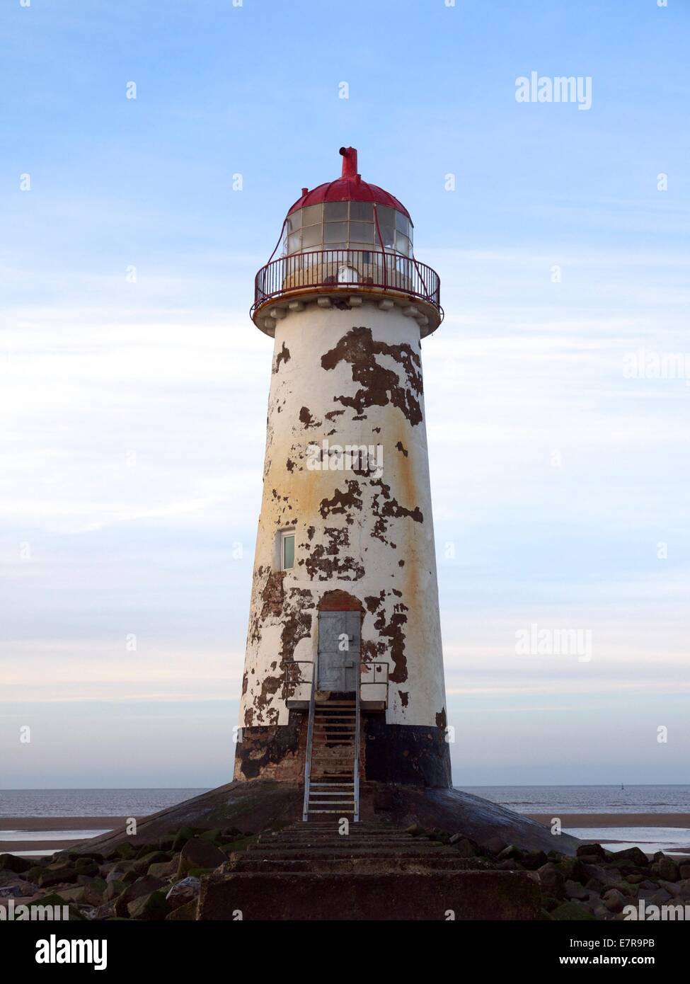 Abandoned lighthouse on the beach with the tide out Stock Photo - Alamy