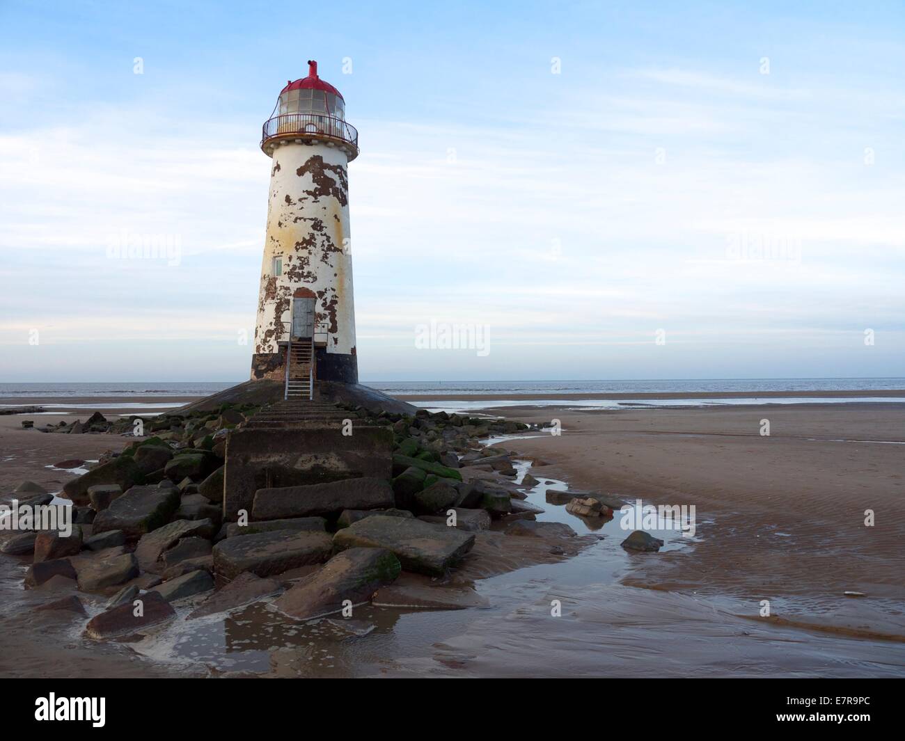 Abandoned lighthouse on the beach with the tide out Stock Photo - Alamy