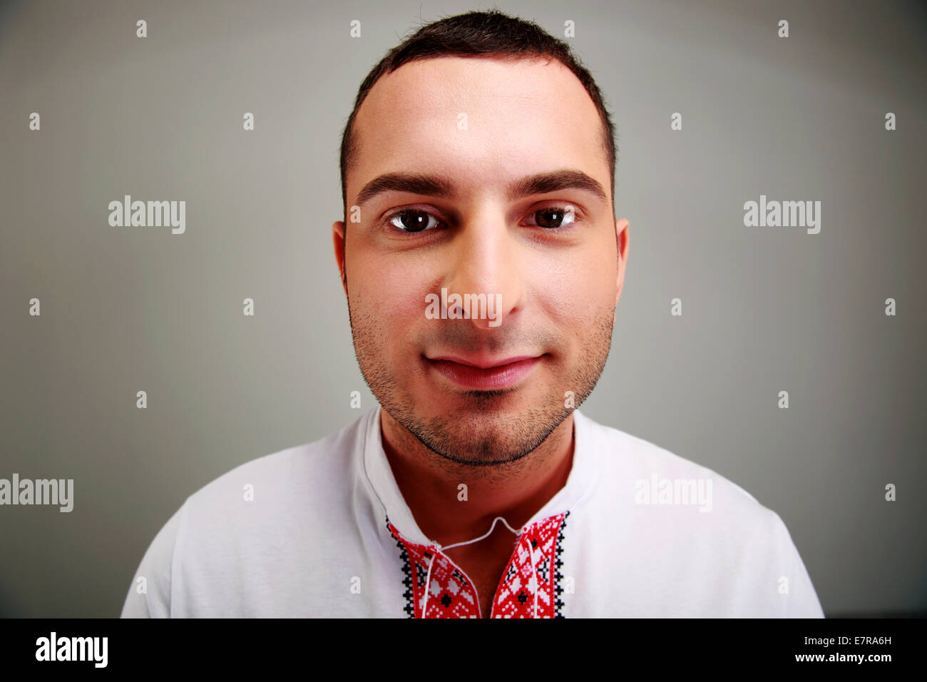 Closeup portrait of man in the Ukrainian national clothes on gray ...
