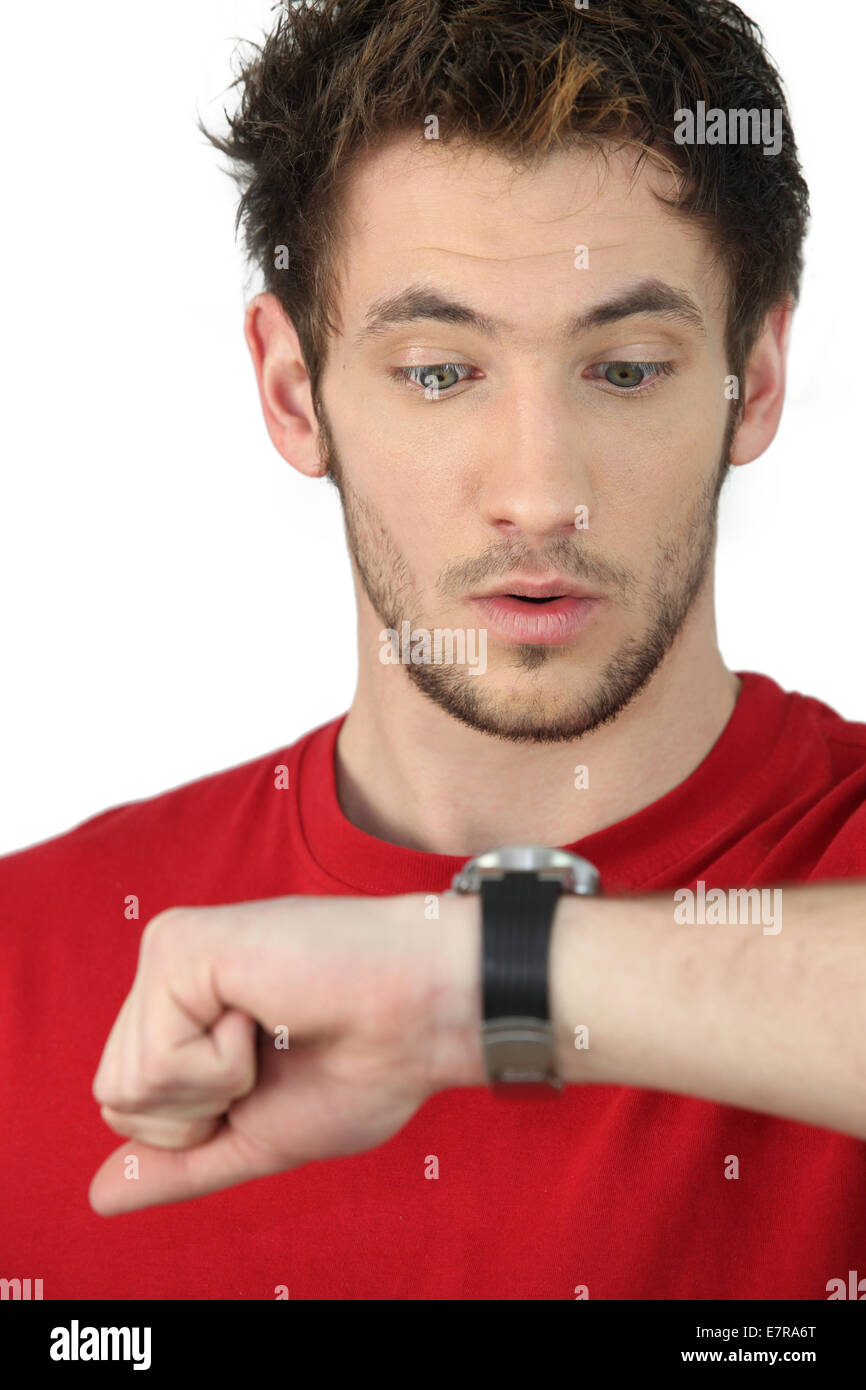 Man looking at the time Stock Photo - Alamy